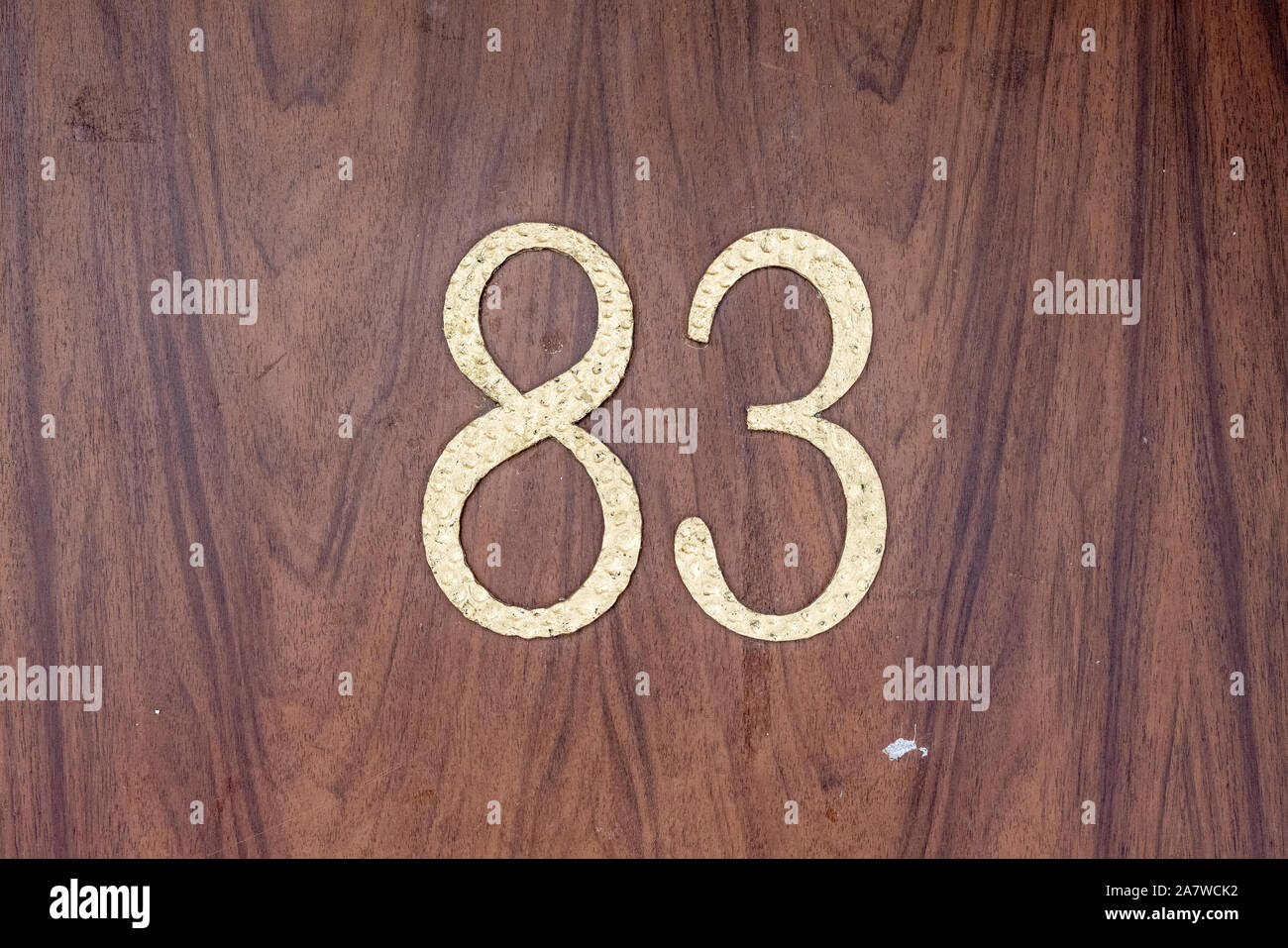 Street number sign on the wall Stock Photo - Alamy