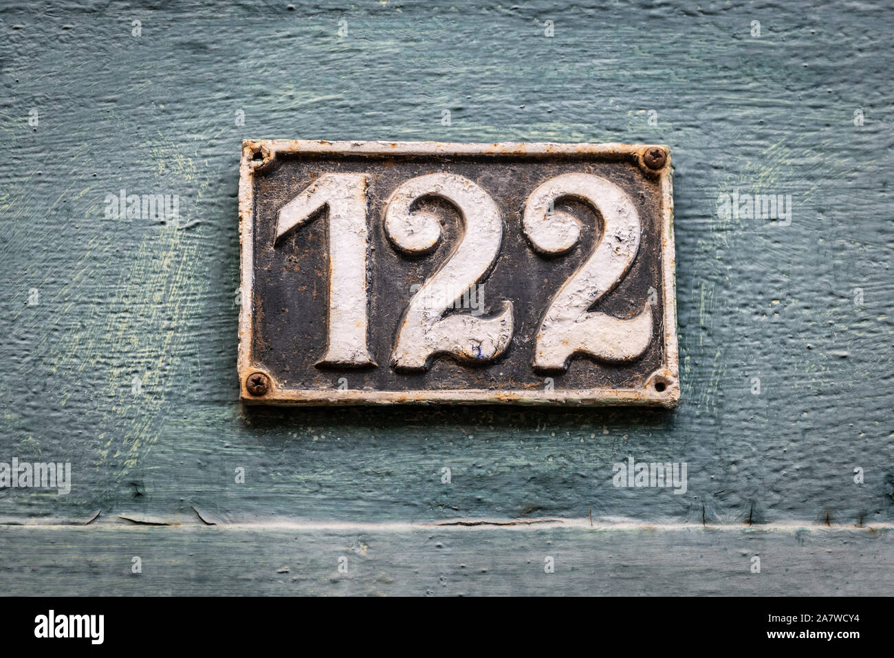 Street number sign on the wall Stock Photo - Alamy