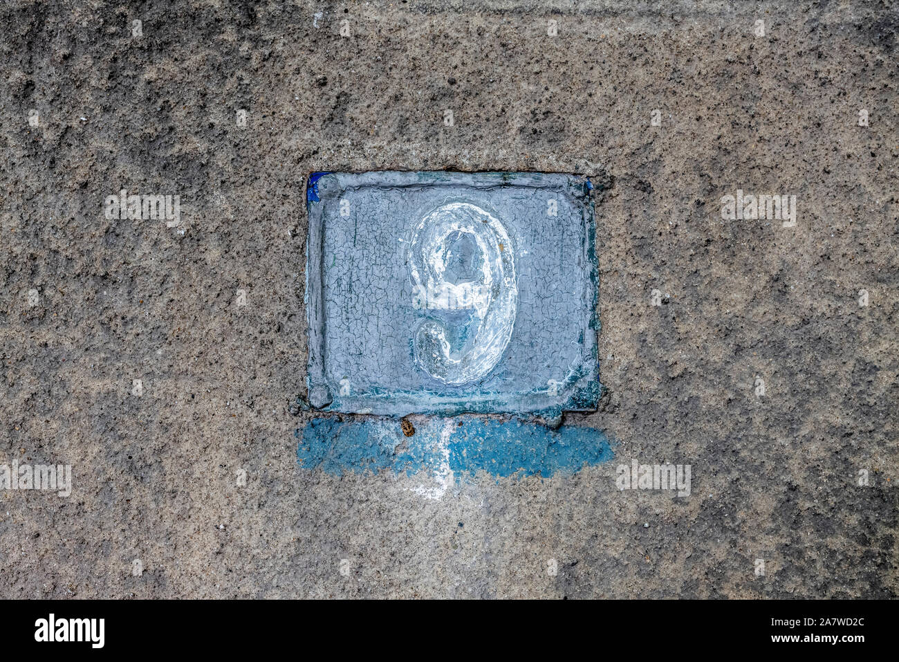 Street number sign on the wall Stock Photo - Alamy