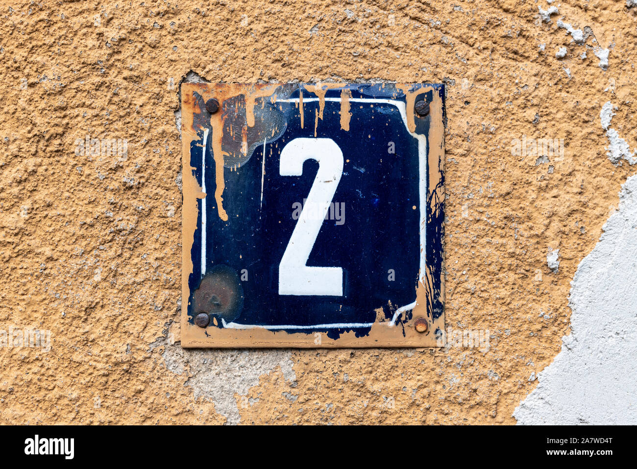 Street number sign on the wall Stock Photo - Alamy