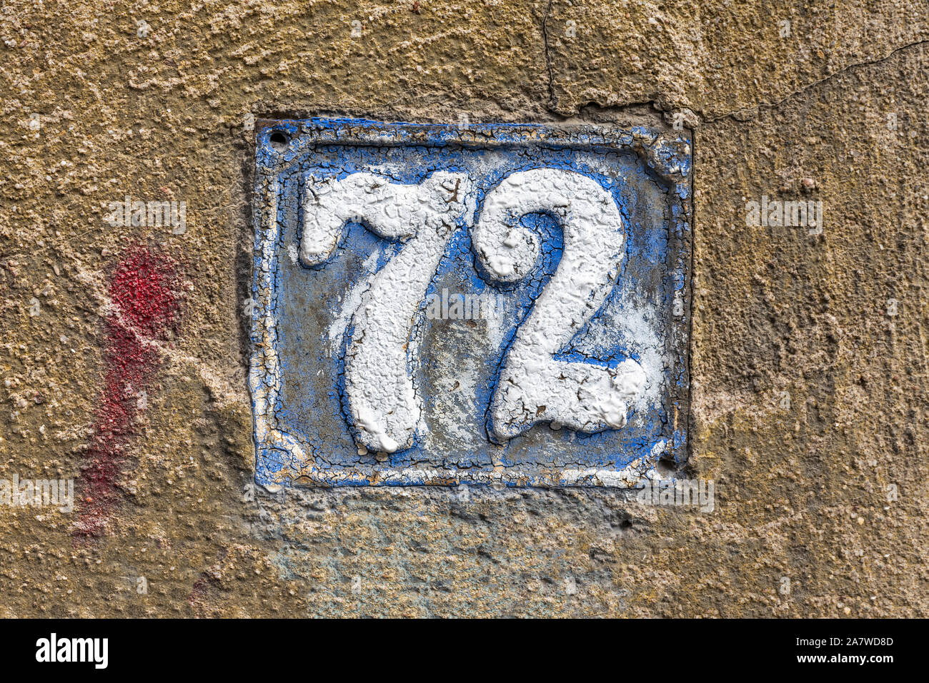 Street number sign on the wall Stock Photo - Alamy