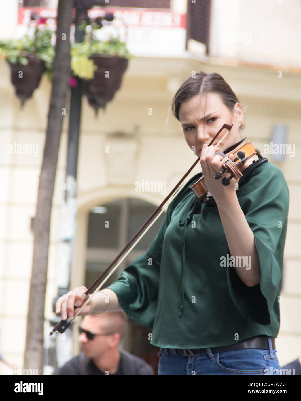 Street musicians playing violin at streets of Belgrade Stock Photo - Alamy