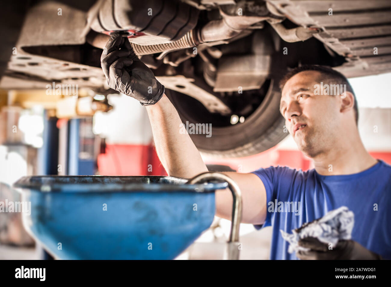 Mechanic under car oil hi-res stock photography and images - Alamy