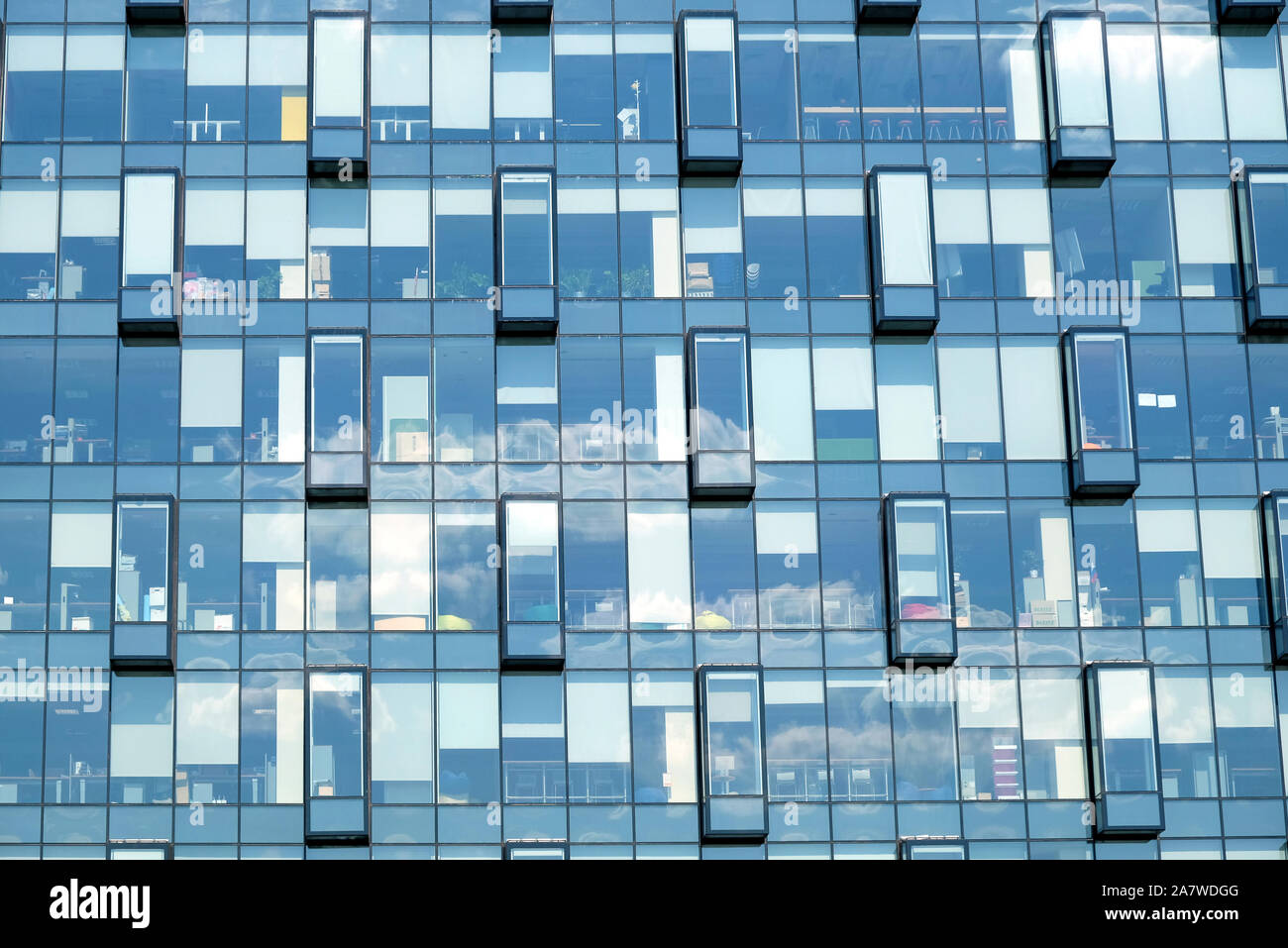 Facade with glass wall of modern office building with many large ...
