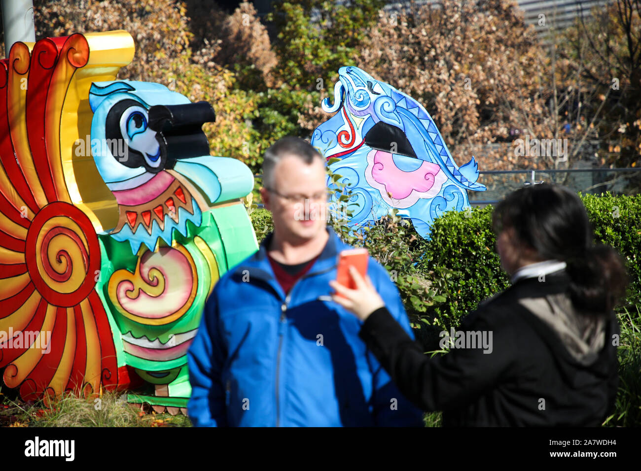 New York, USA. 4th Nov, 2019. People are seen in front of lanterns of ...