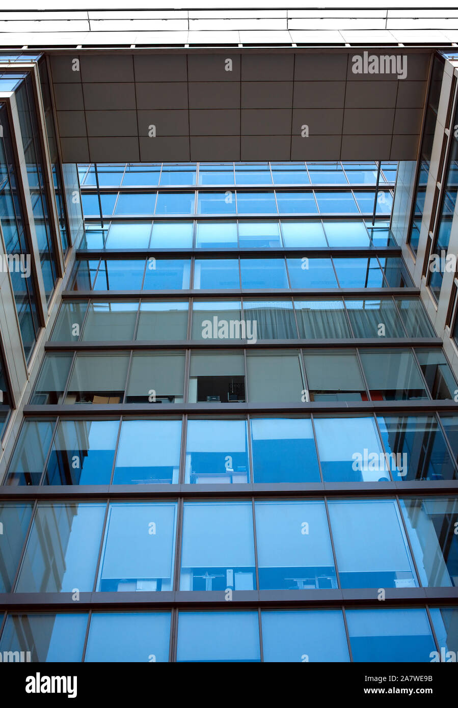 Facade with glass wall of modern office building with many large ...