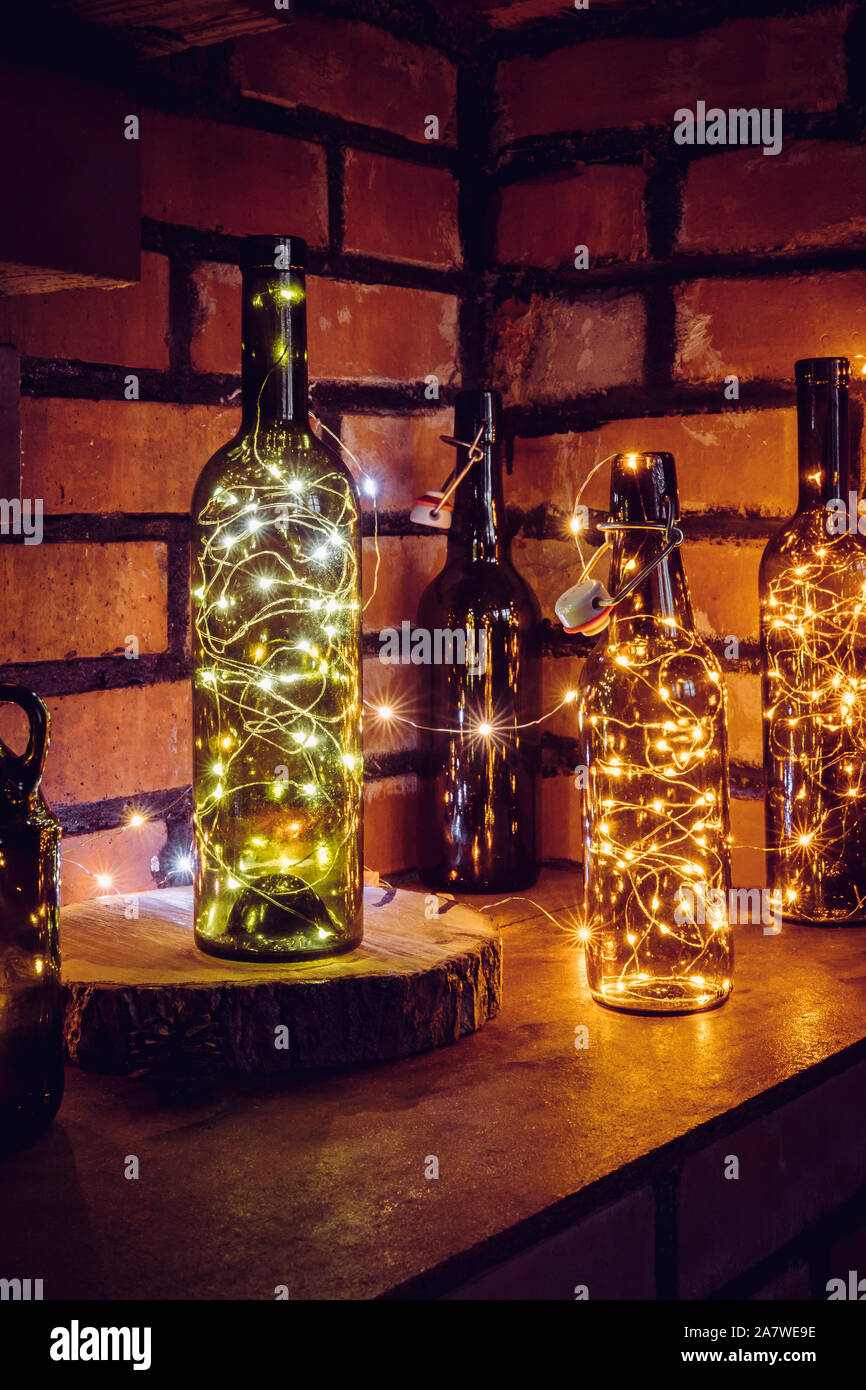 Lot of different vintage style beer bottles and green wine bottles ...