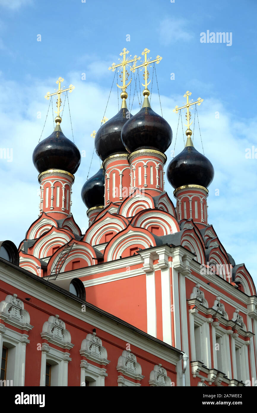 Top of Russian Christian church colored pink with cupolas with golden ...