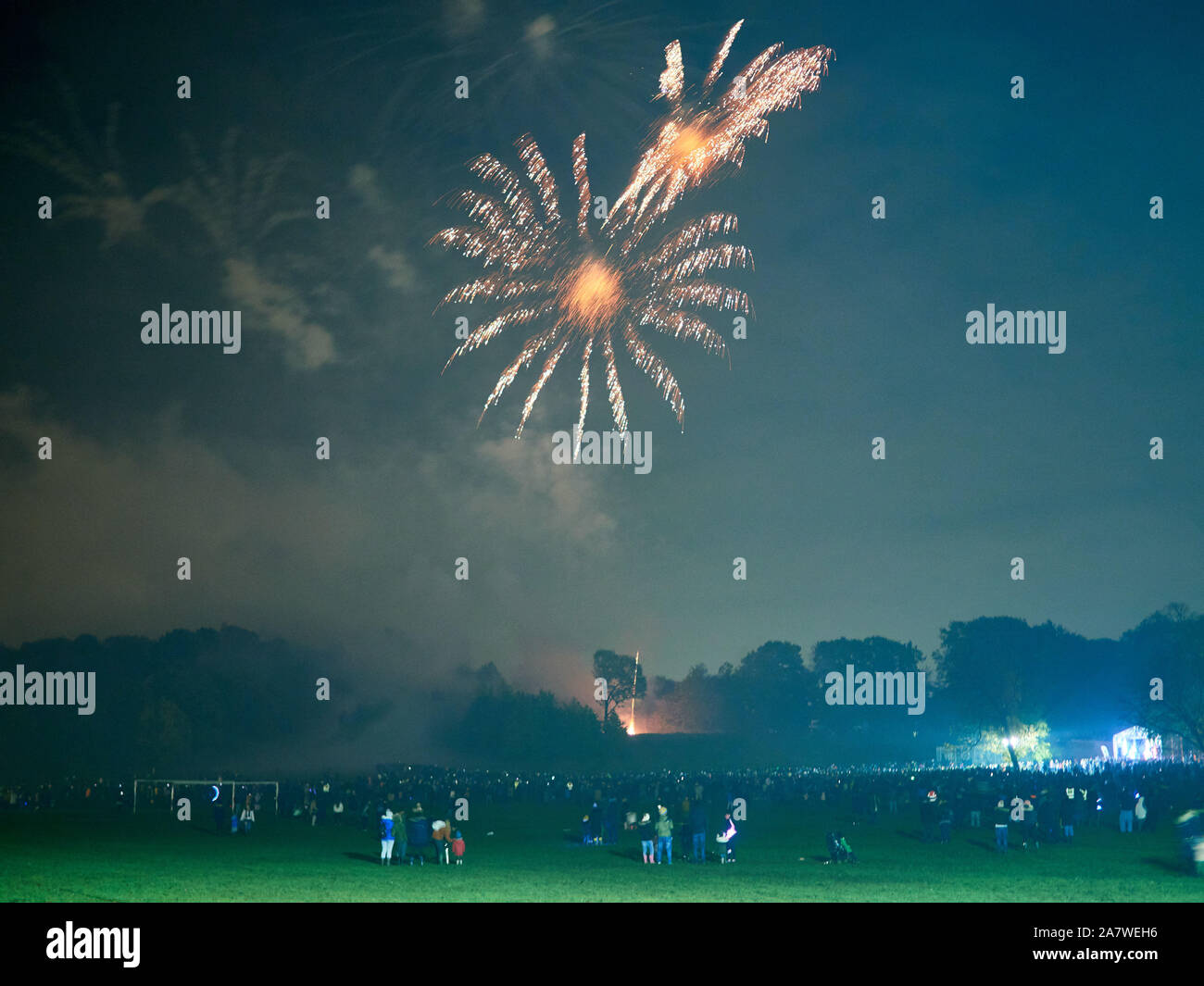 Fireworks light up the sky in front of a crowd, at Thornes Park ...