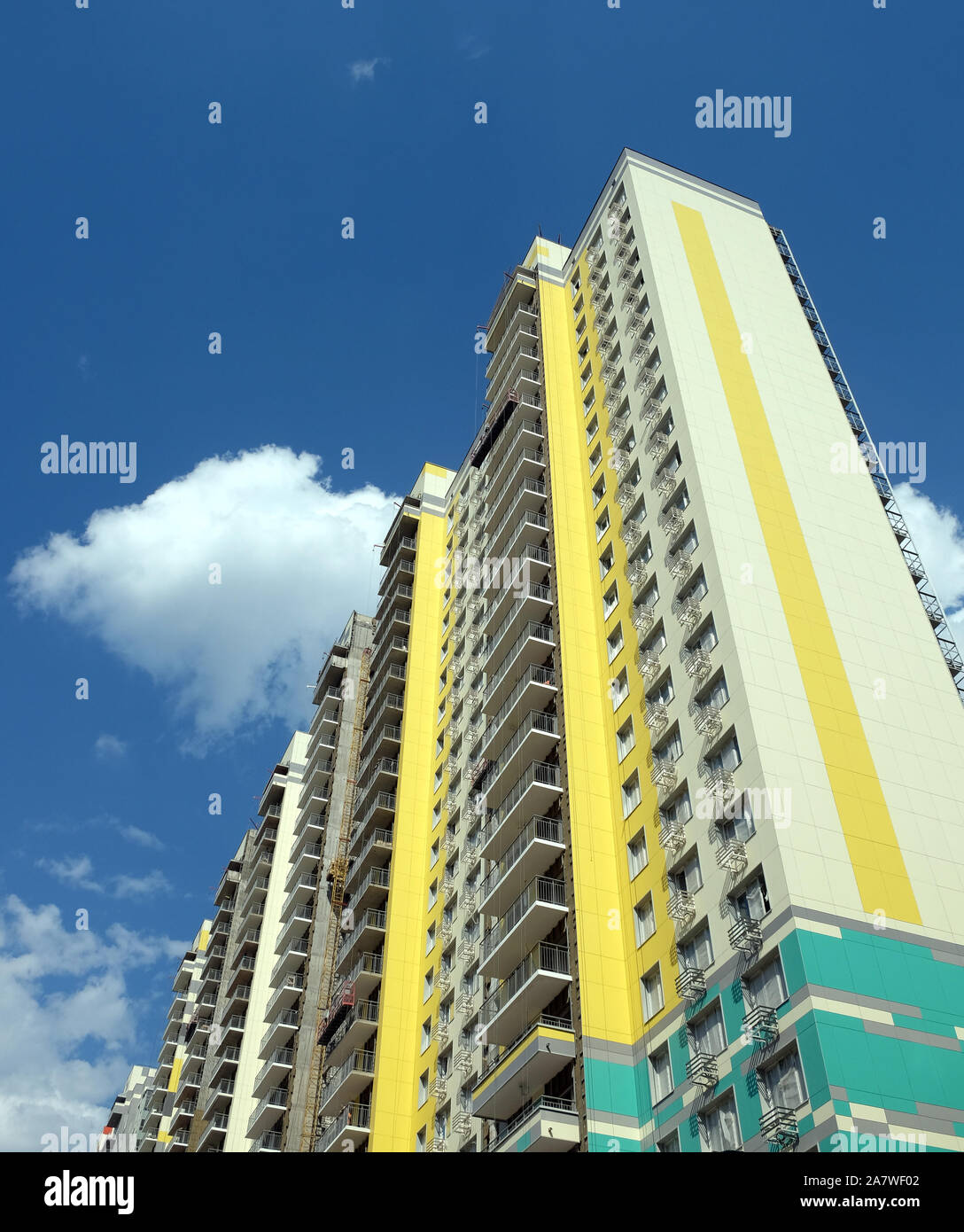 Facade of funny colorful modern residential building side view vertical ...