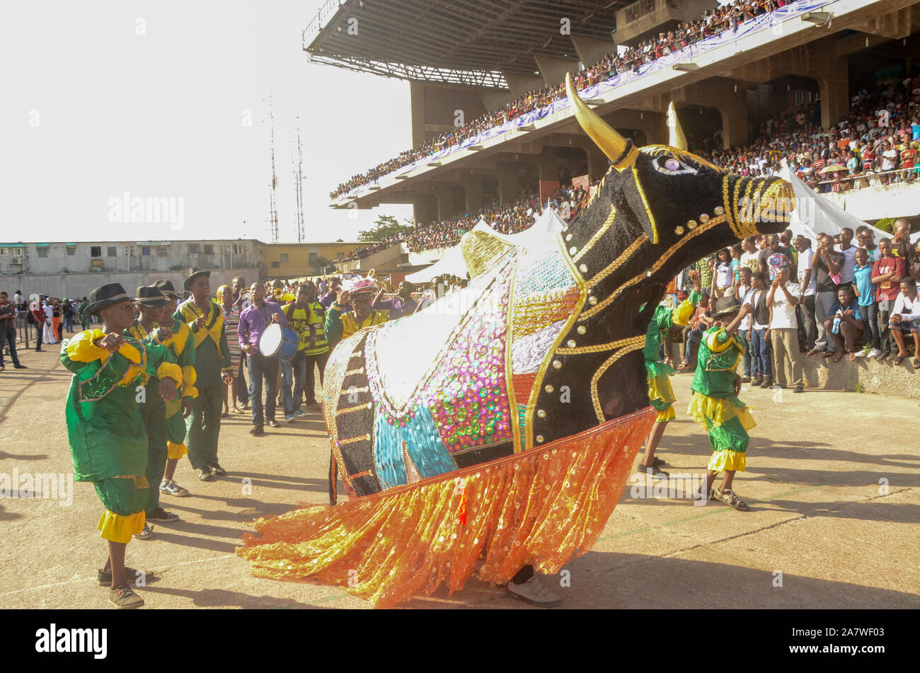 African artist marching with their crafted bull during the Lagos ...
