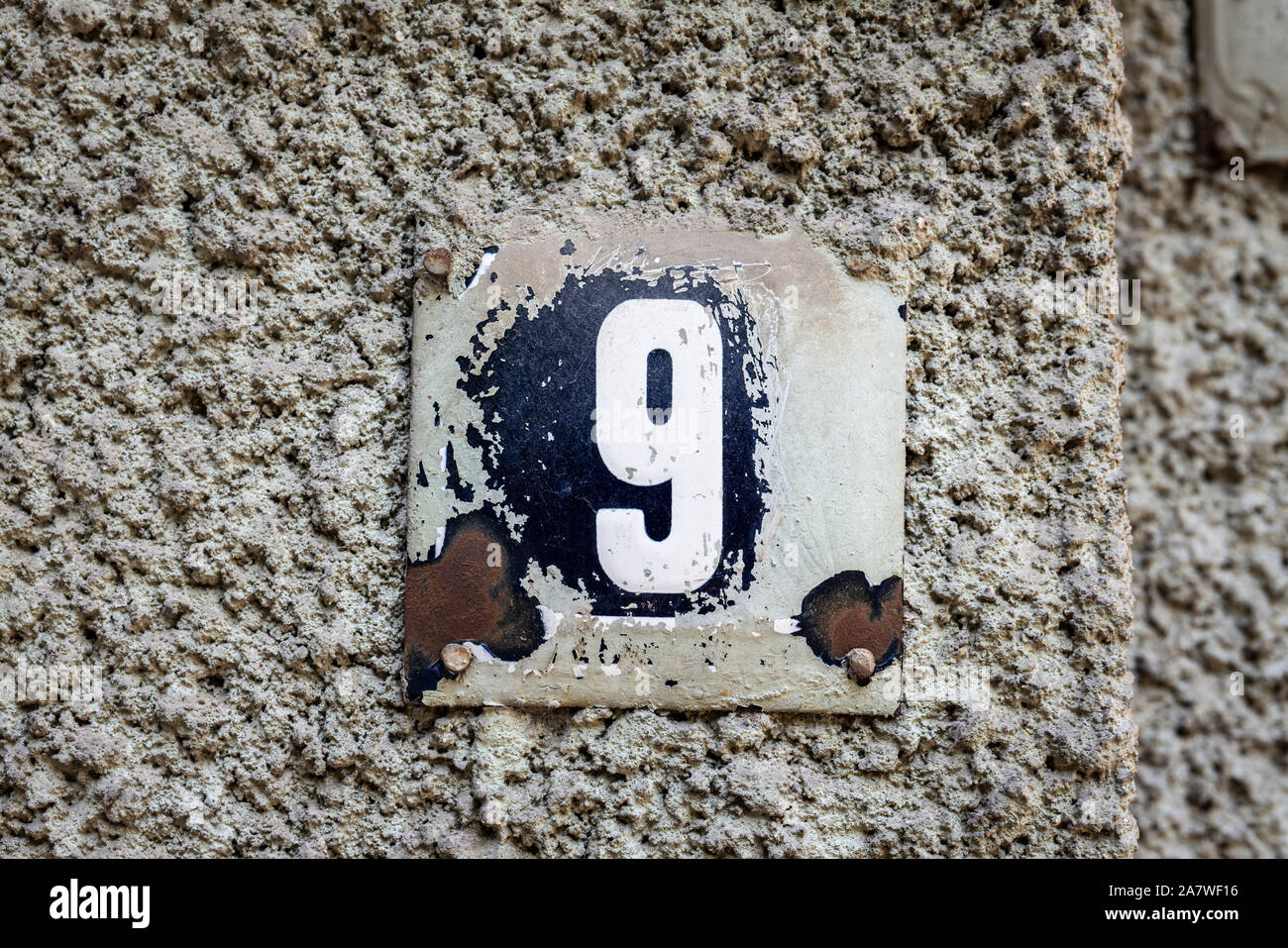 Street number sign on the wall Stock Photo - Alamy