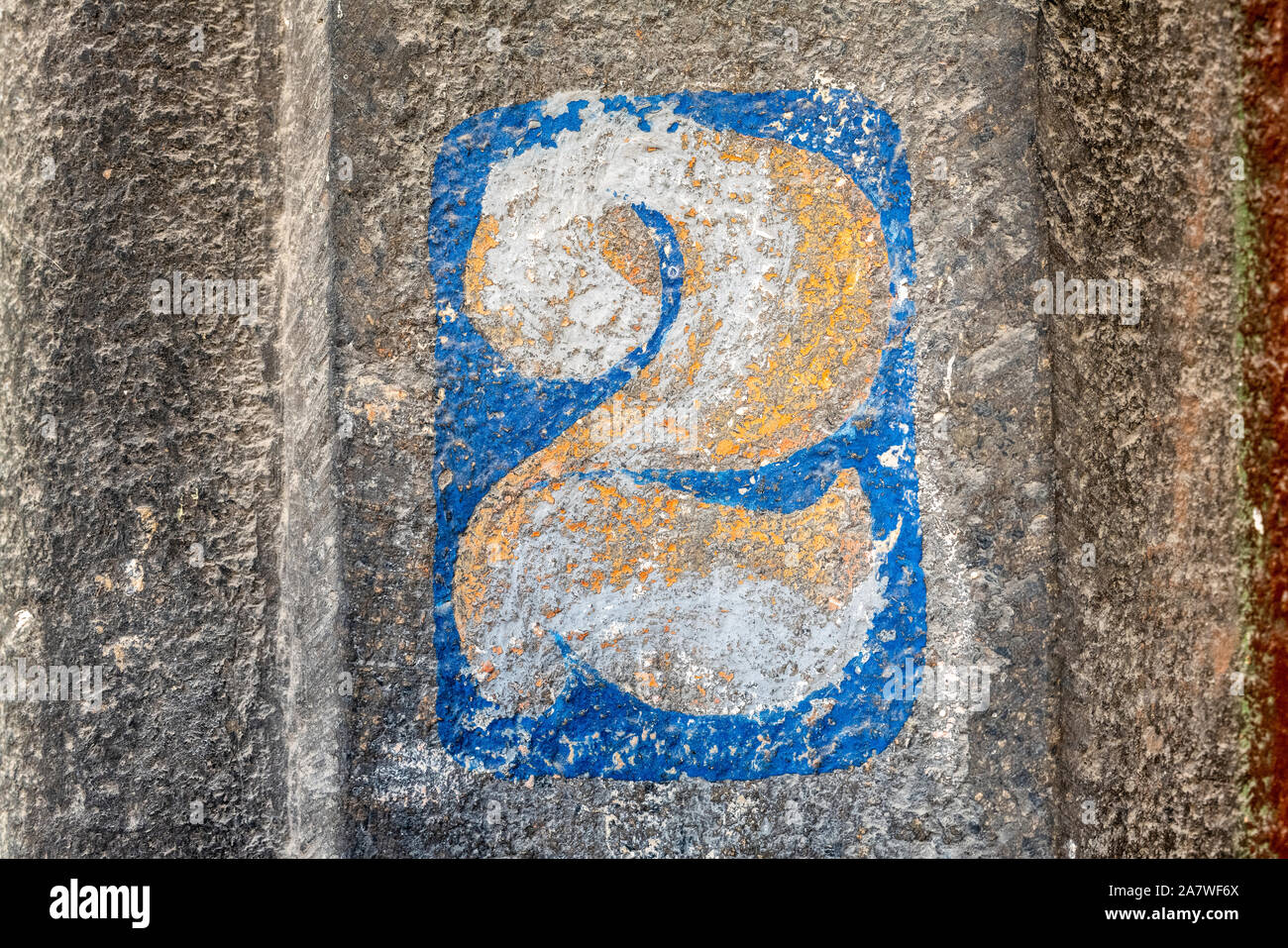Street number sign on the wall Stock Photo - Alamy