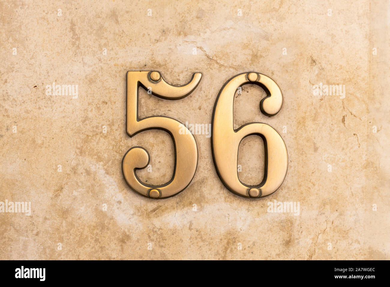 Street number sign on the wall Stock Photo - Alamy