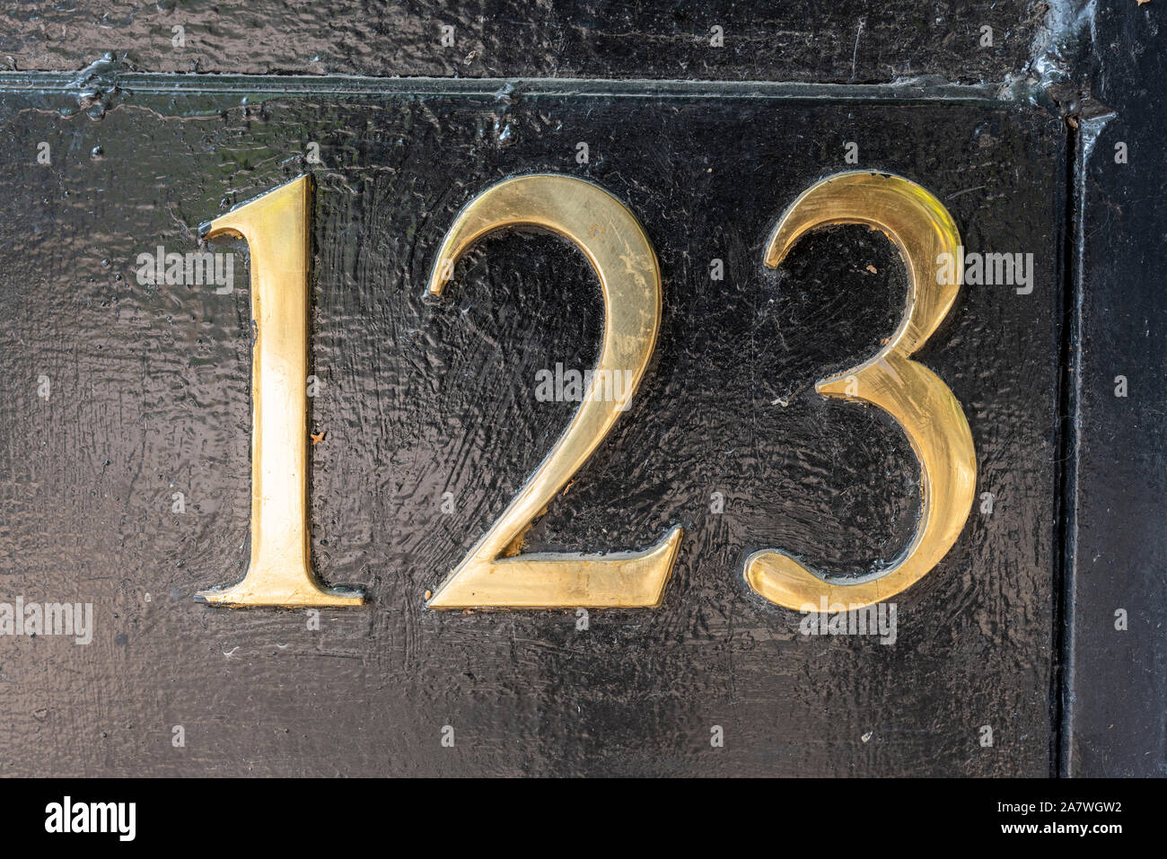 Street number sign on the wall Stock Photo - Alamy