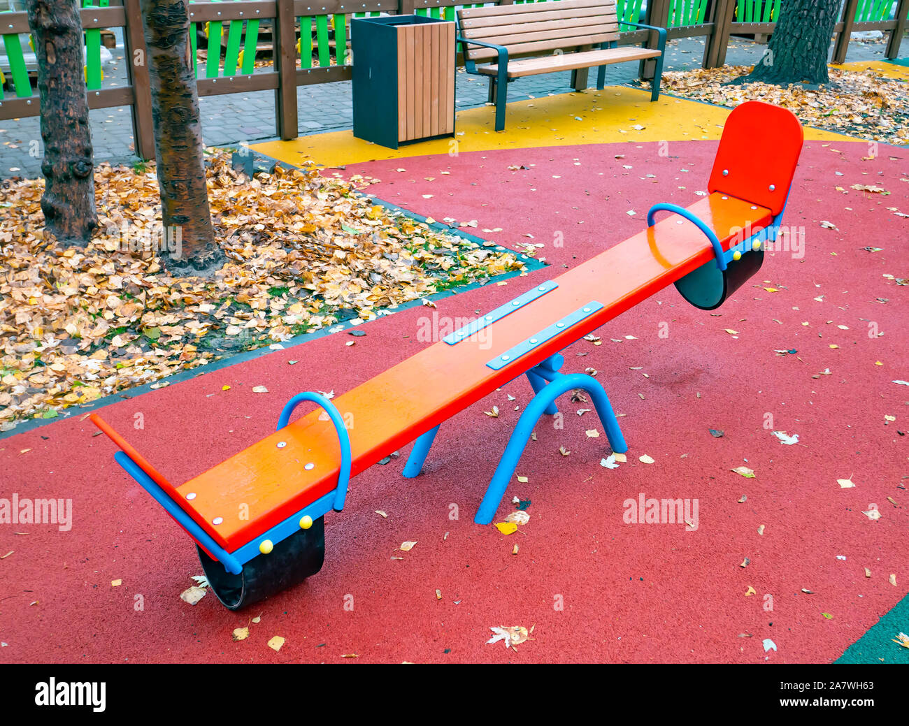 Children's playground with a swing in the autumn park. Games and sports ...
