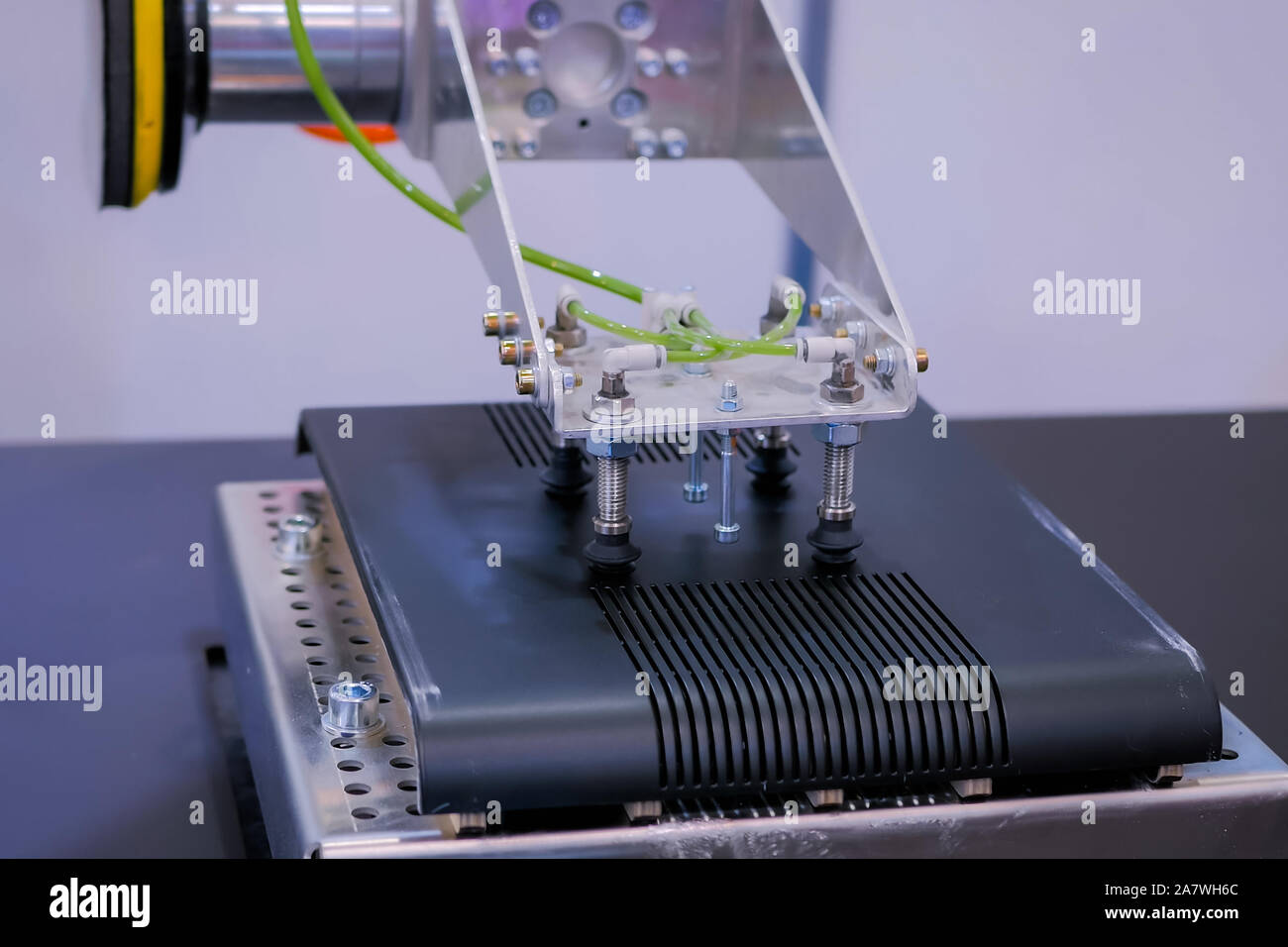Automated robotic arm moves and places objects at trade show ...