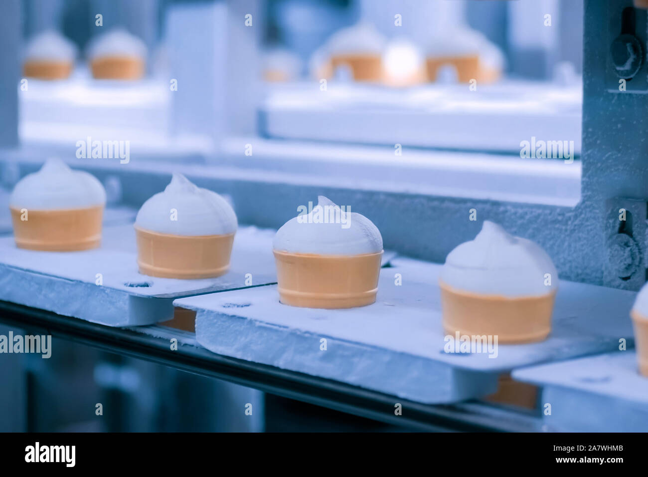 Ice cream automatic production line - conveyor belt with icecream cones ...