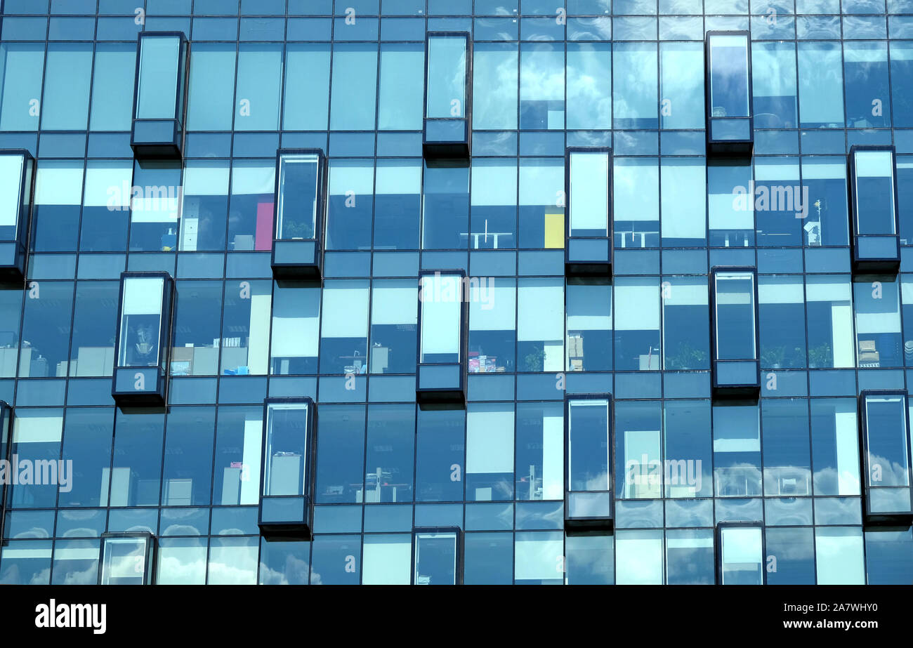 Facade with glass wall of modern office building with many large ...