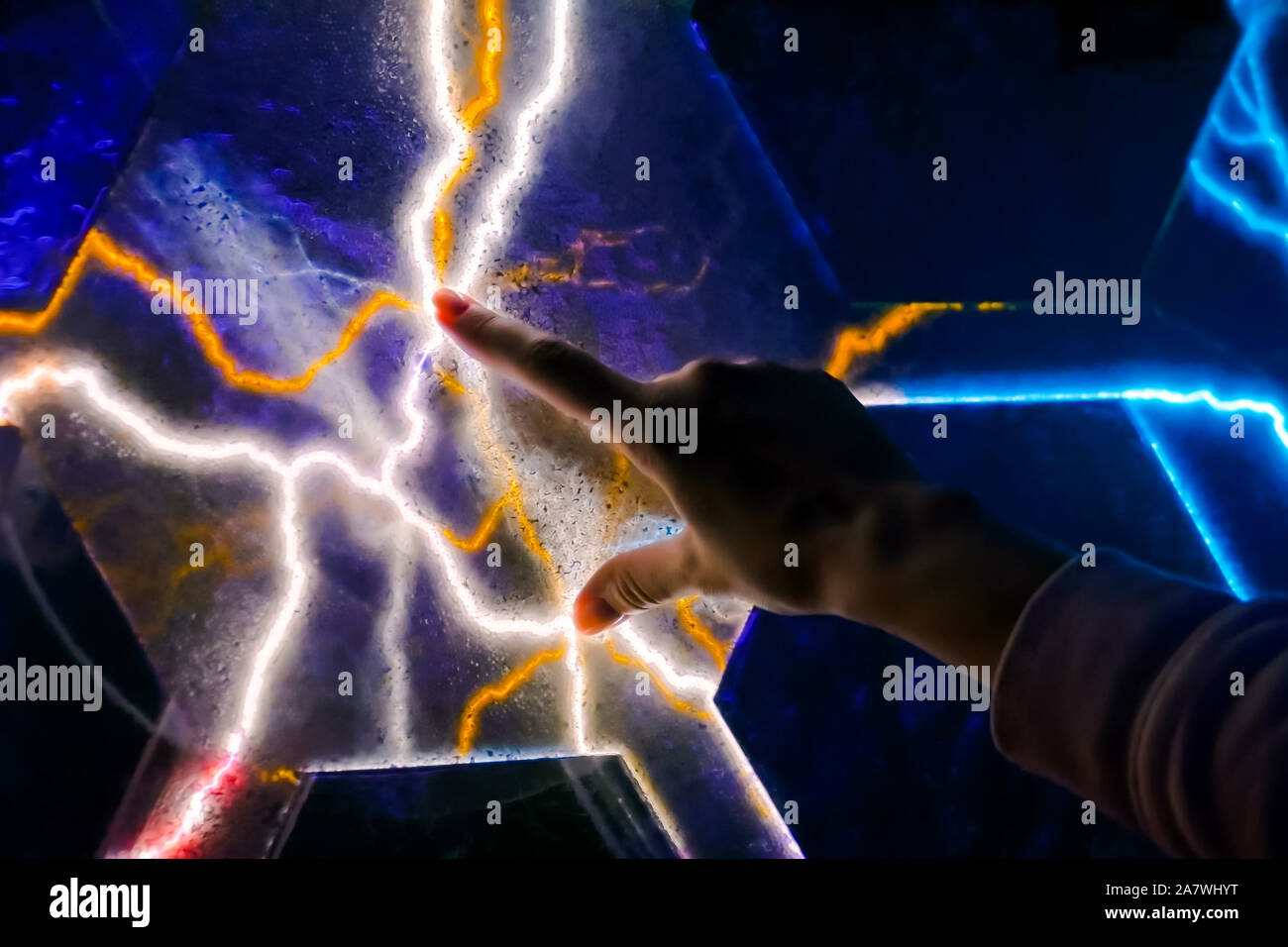 Woman touching plasma panel display Stock Photo - Alamy