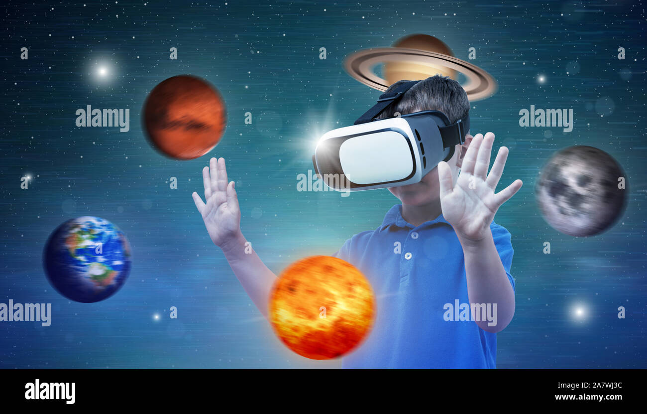 Planets revolve around boy with virtual reality glasses. Concept of ...