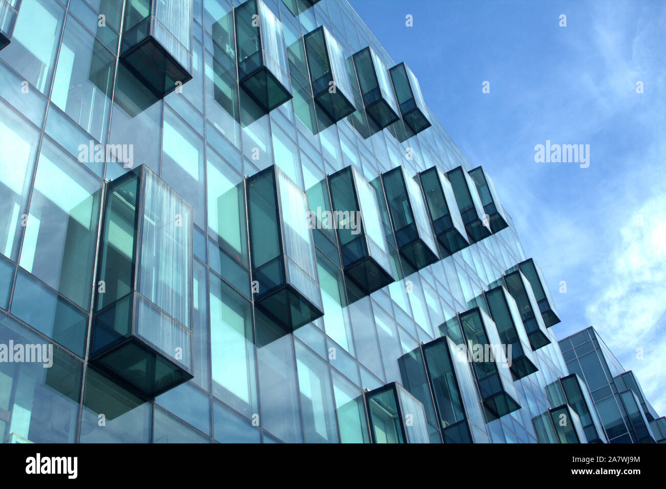Glass wall of modern office building with many large panoramic windows ...