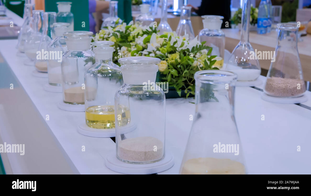 Rotating glass bottles with different chemical reagents samples Stock ...