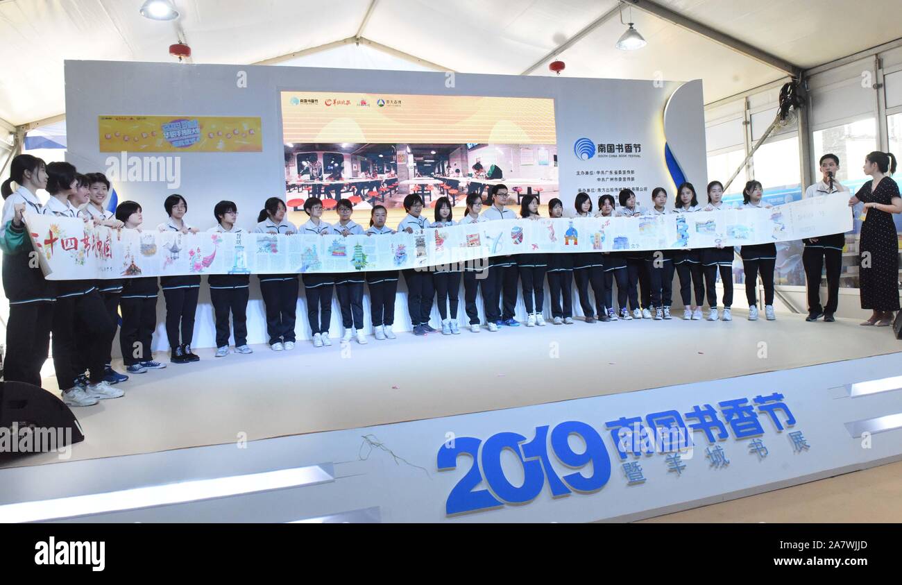 Students demonstrate their works during Chinese self-designed newspaper ...