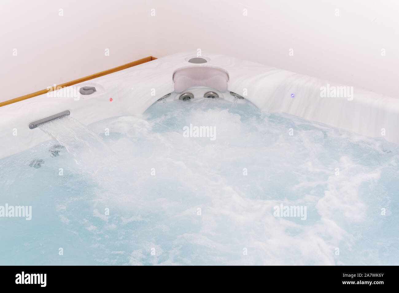 Bath filled with water with massage jets for skin and body, massage and ...