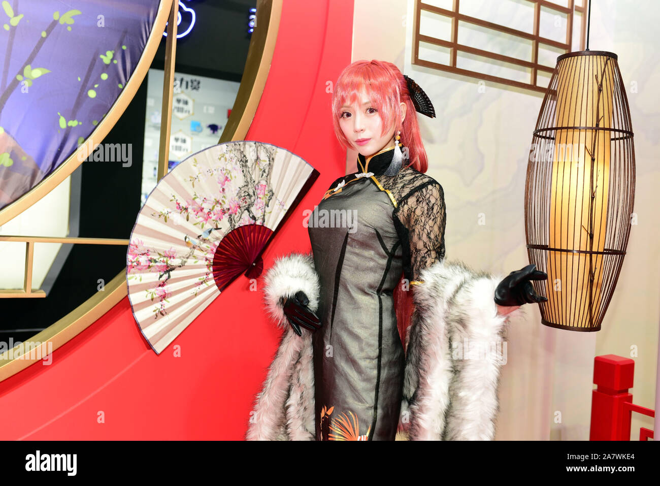 A Chinese showgirl dressed in cosplay costume featuring Monarch from ...