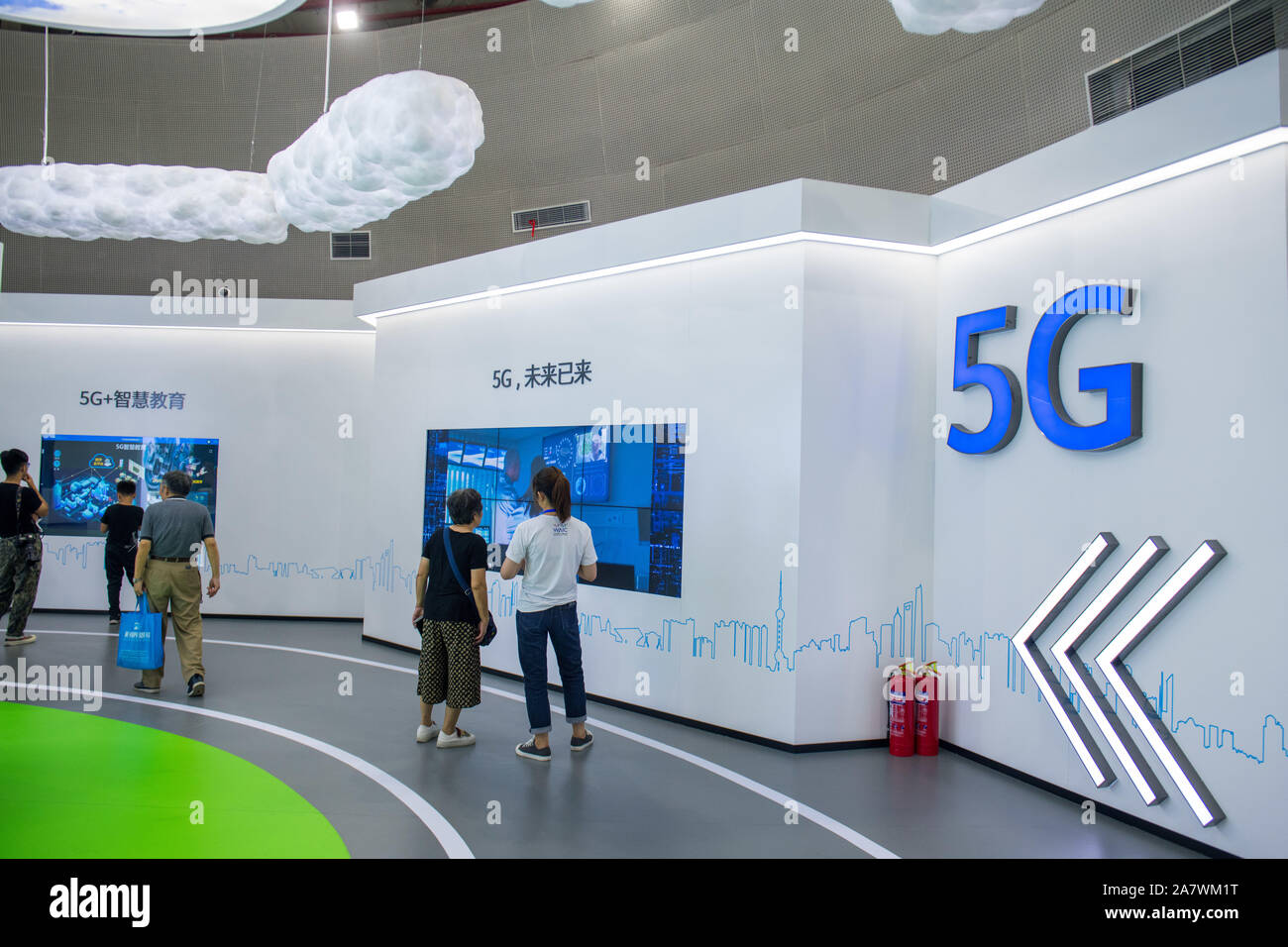 Invited guests visit and experience technologies inside the exhibition ...