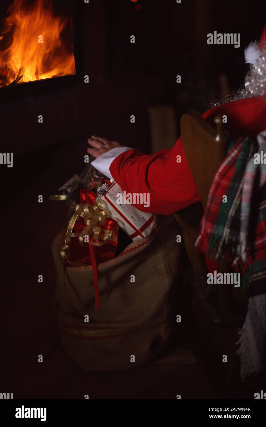 Santa claus in front fireplace hi-res stock photography and images - Alamy