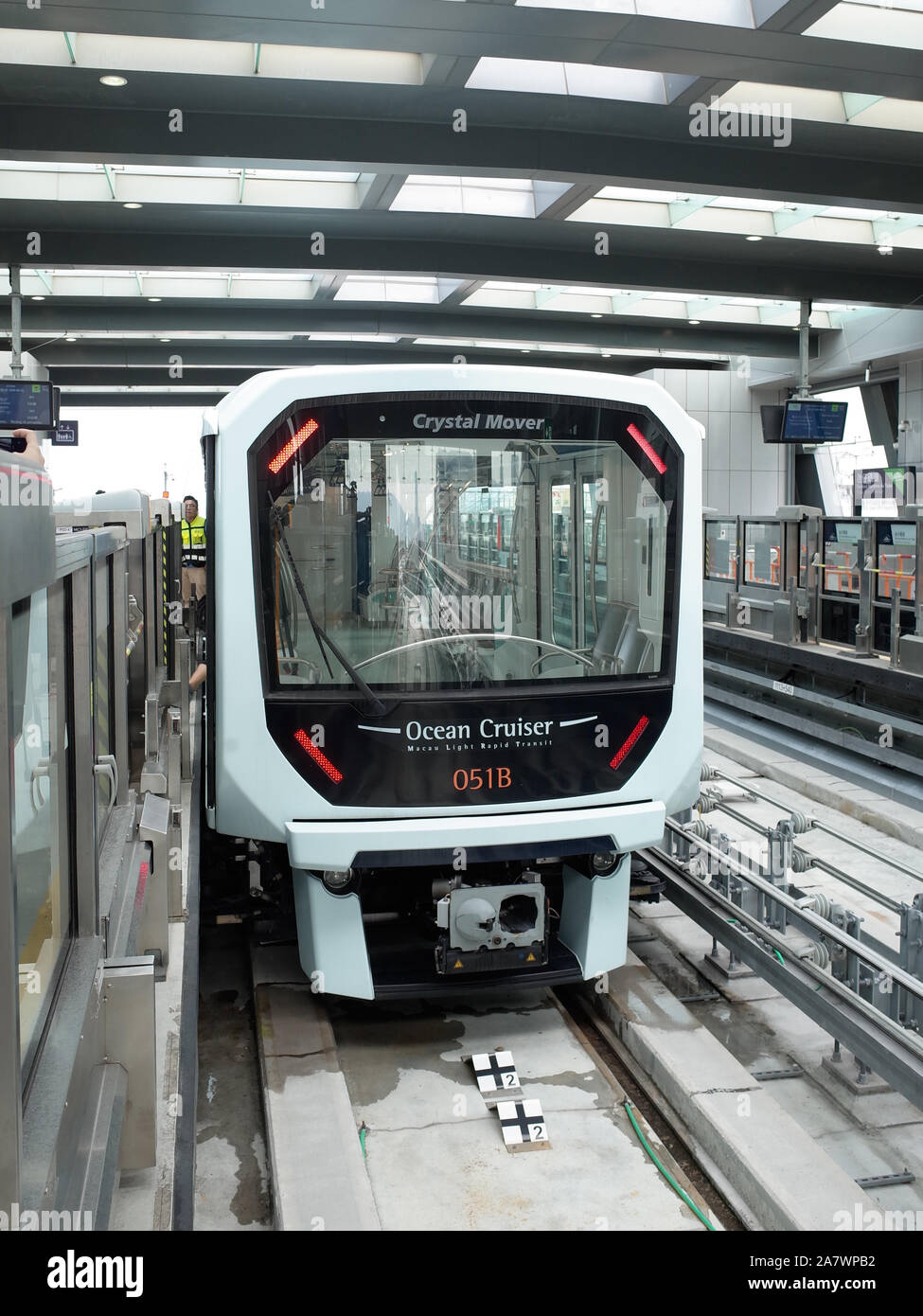 Chinese workers introduce the Light Rail Transit (LRT) system at the ...