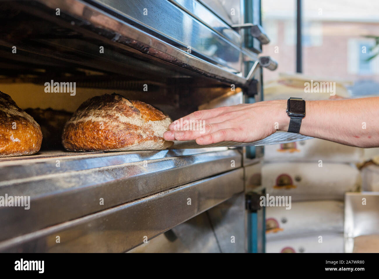 Hand reaching bread in hi-res stock photography and images - Alamy