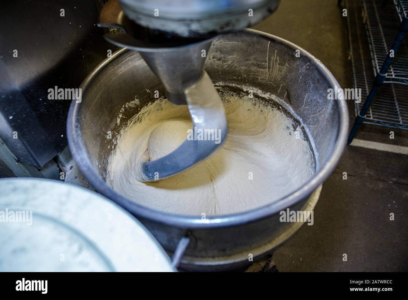 Above-view of bread dough being mixed in a commercial kitchen Stock ...