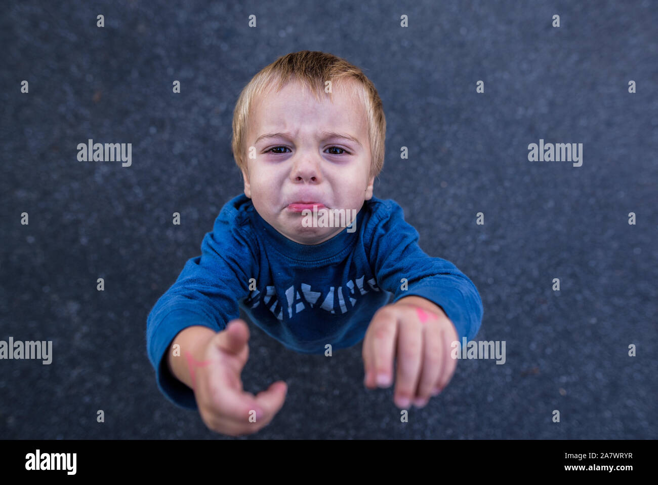 toddler boy viewed from above looking up at camera and pouting Stock ...