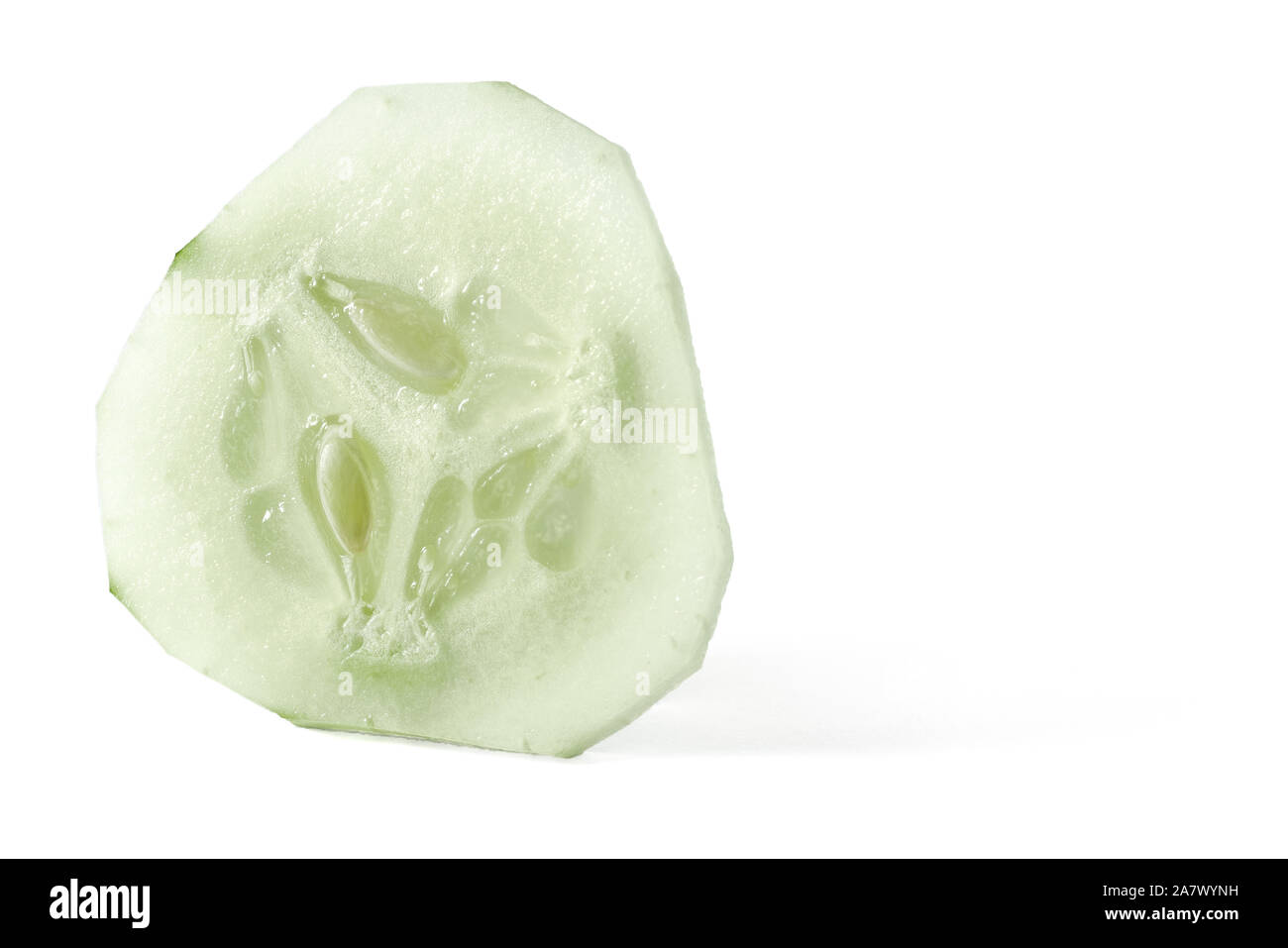 Cucumber slice, with skin peeled, isolated on white background Stock ...
