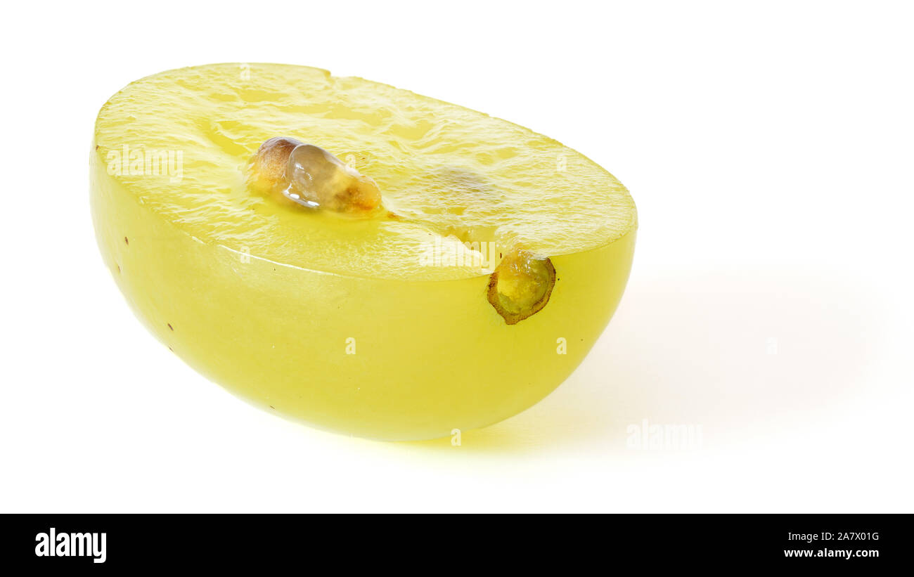 Single yellow grape fruit cut in half isolated on white background ...
