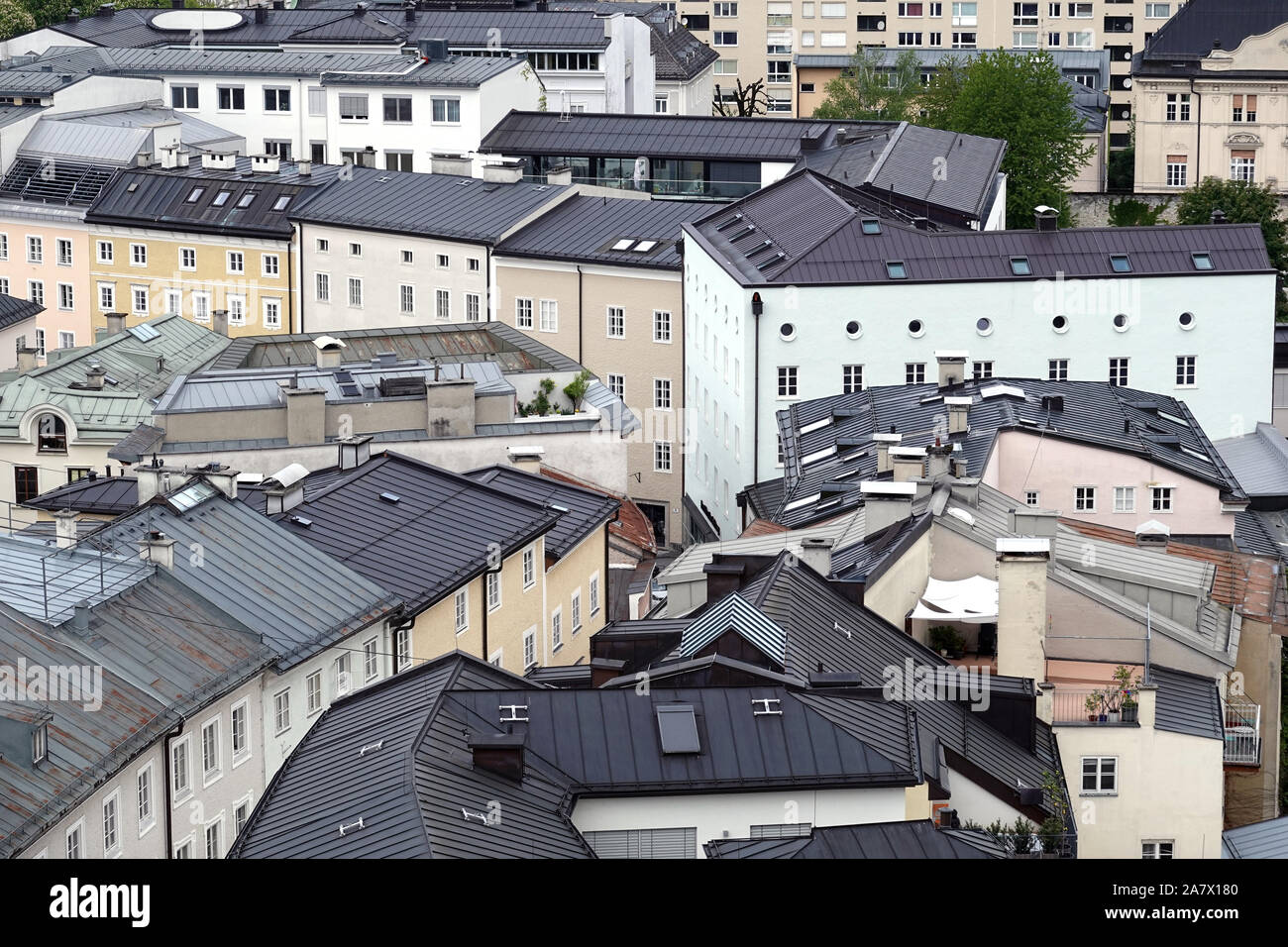 Top view of different buildings roofs with chimneys in typical west ...