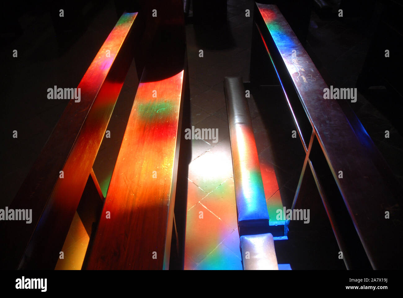 Coloured light reflected from stain glass windows, Baclayon Church ...