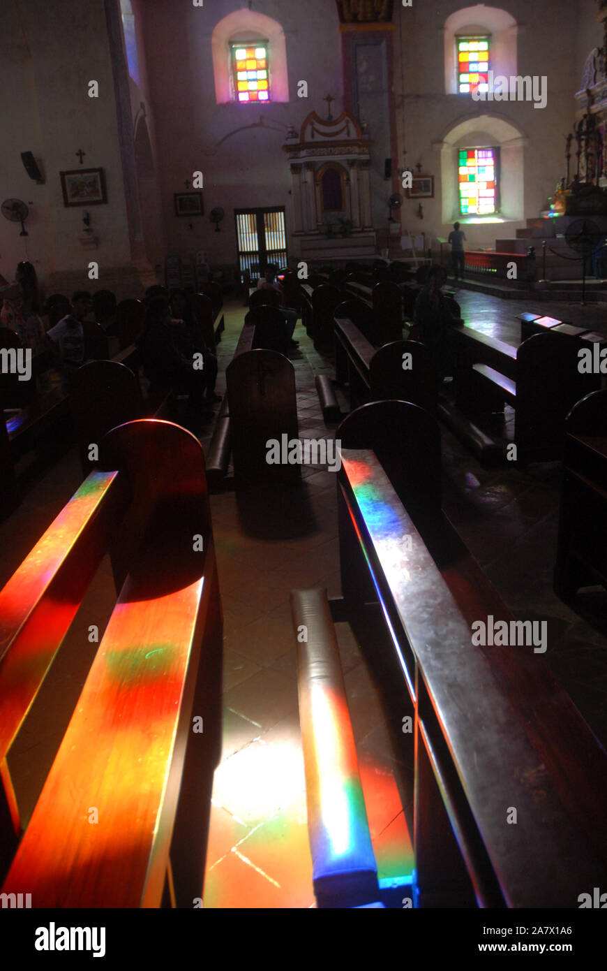 Coloured light reflected from stain glass windows, Baclayon Church ...