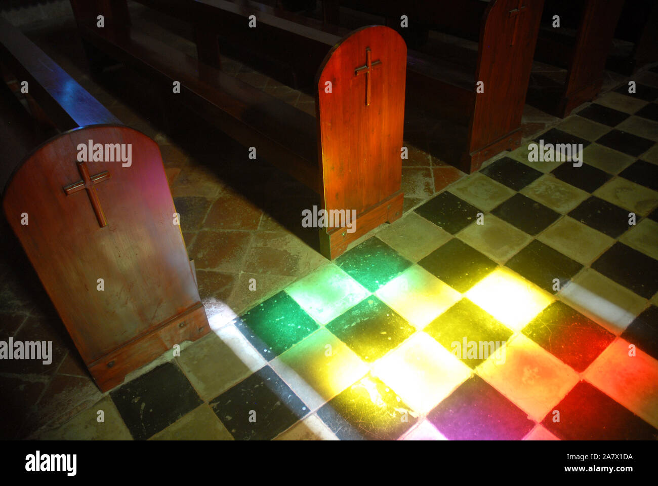 Coloured light reflected from stain glass windows, Baclayon Church ...