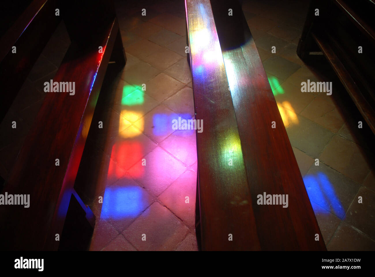 Coloured light reflected from stain glass windows, Baclayon Church ...