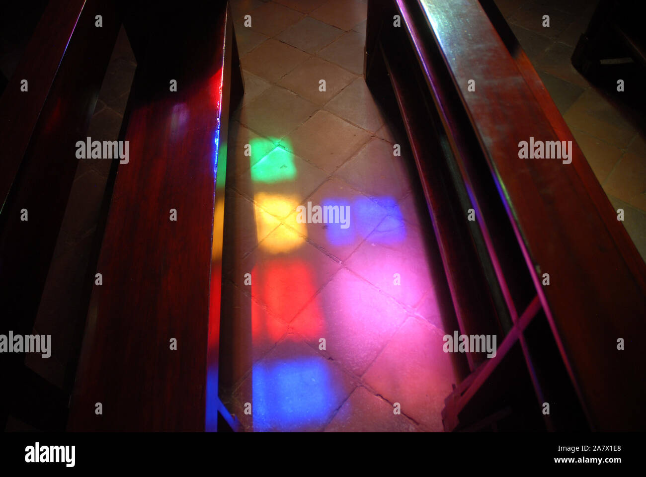 Coloured light reflected from stain glass windows, Baclayon Church ...