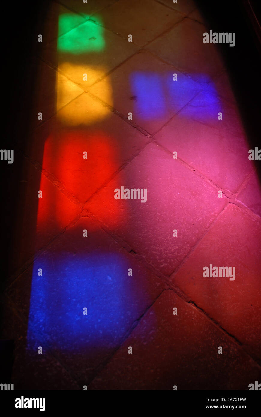 Coloured light reflected from stain glass windows, Baclayon Church ...