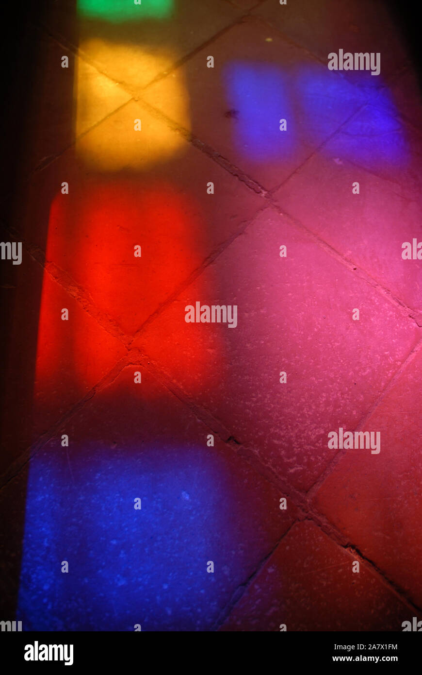 Coloured light reflected from stain glass windows, Baclayon Church ...
