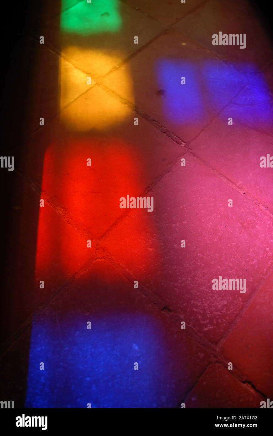 Coloured light reflected from stain glass windows, Baclayon Church ...