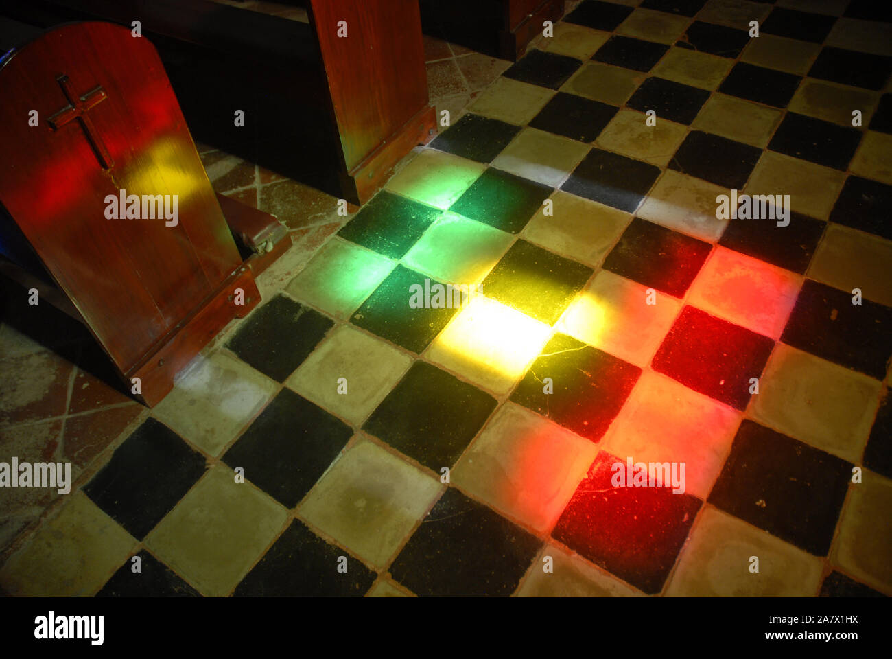 Coloured light reflected from stain glass windows, Baclayon Church ...