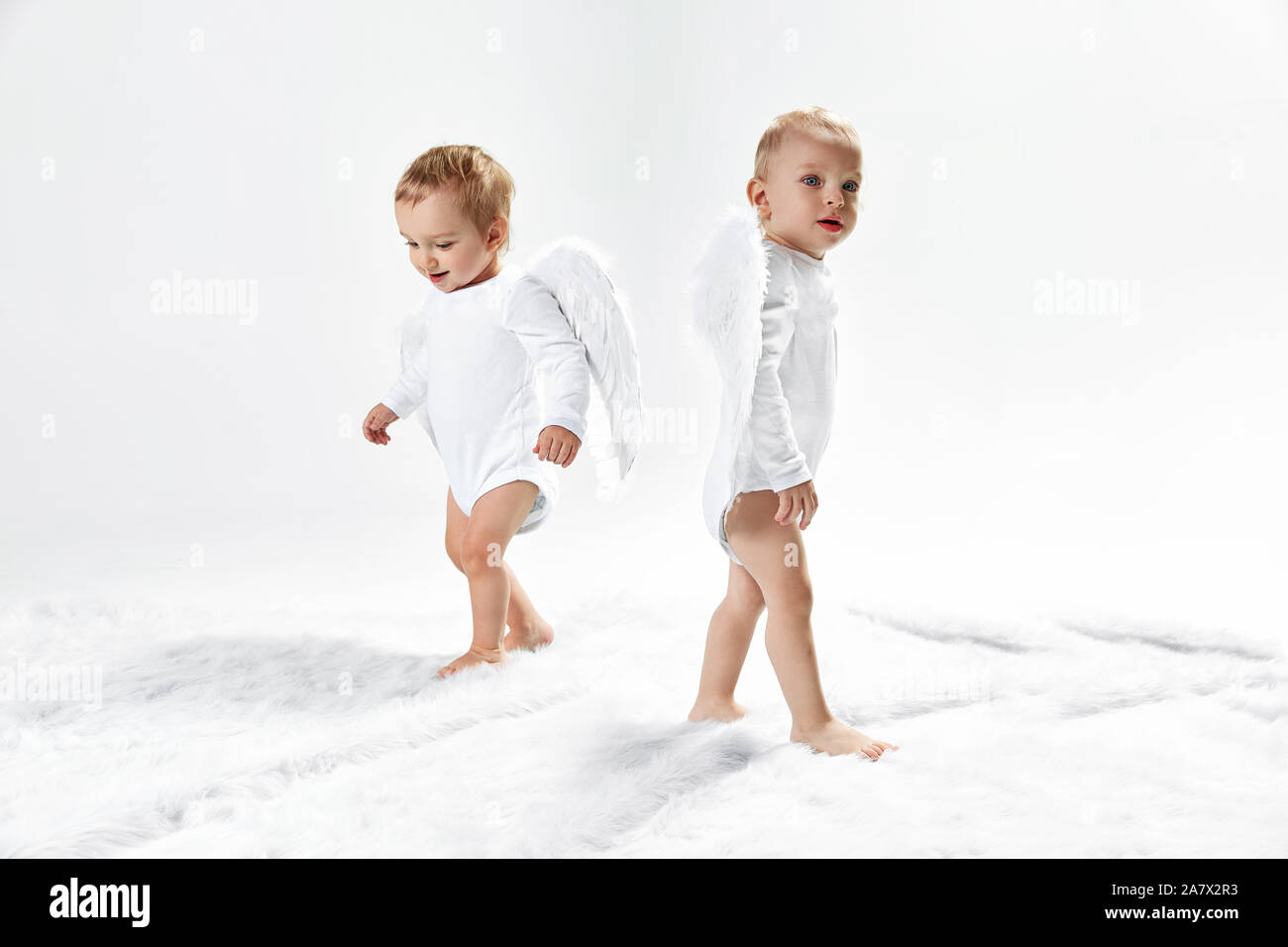 Portrait of a two little, cute angel - brothers Stock Photo - Alamy