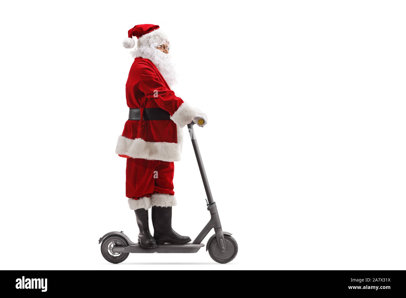 Full length portrait of Santa Claus riding an electric scooter isolated ...